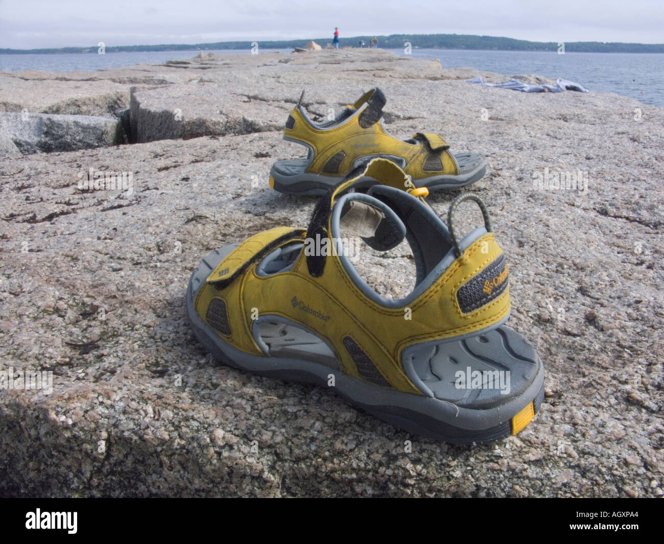 Kids shoes left behind while on vacation playing on a jetty in the ...