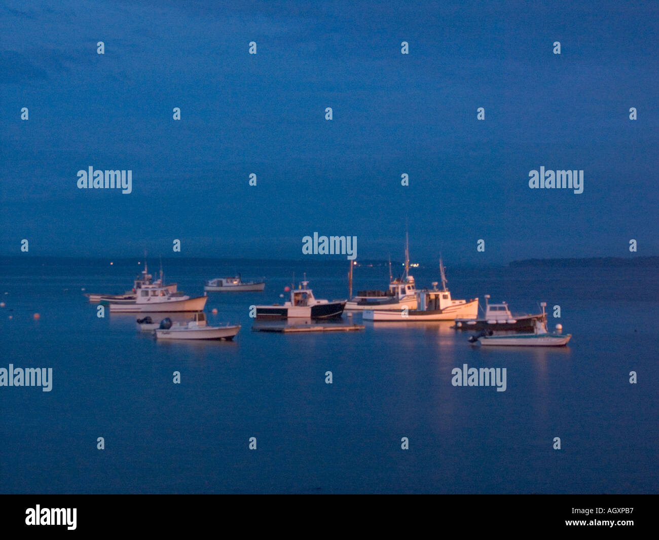 Boats in the harbor at sunset Stock Photo - Alamy