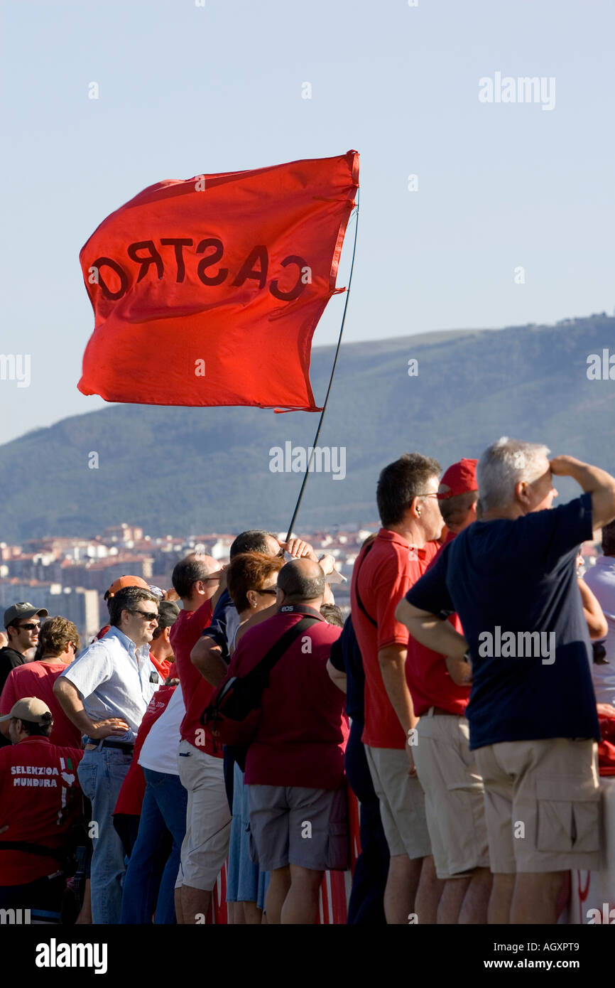 Red flag held by team supporters during traineras regatta Puerto Viejo ...