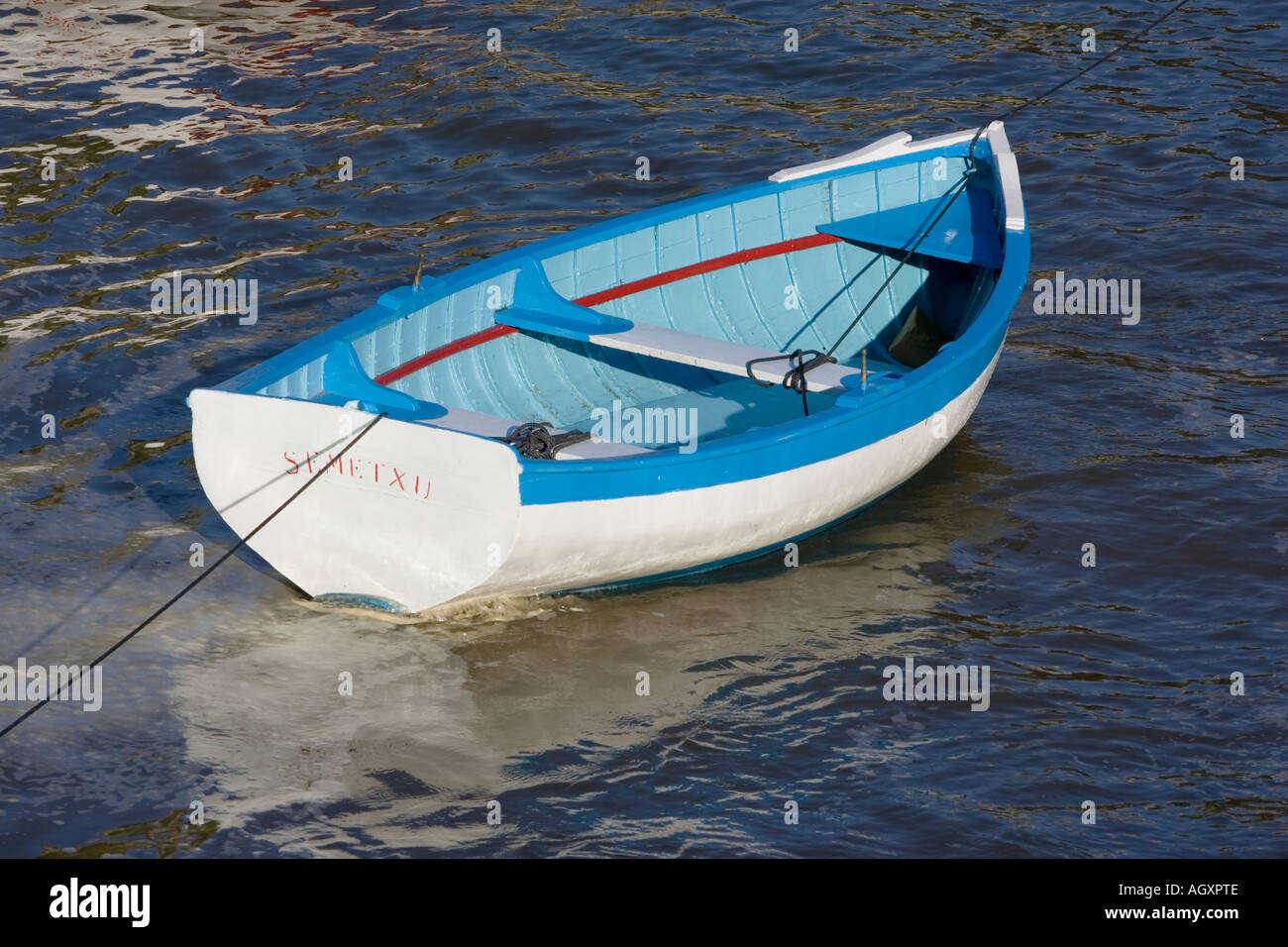 Blue and white rowing boat at mooring in harbour Puerto Viejo de ...