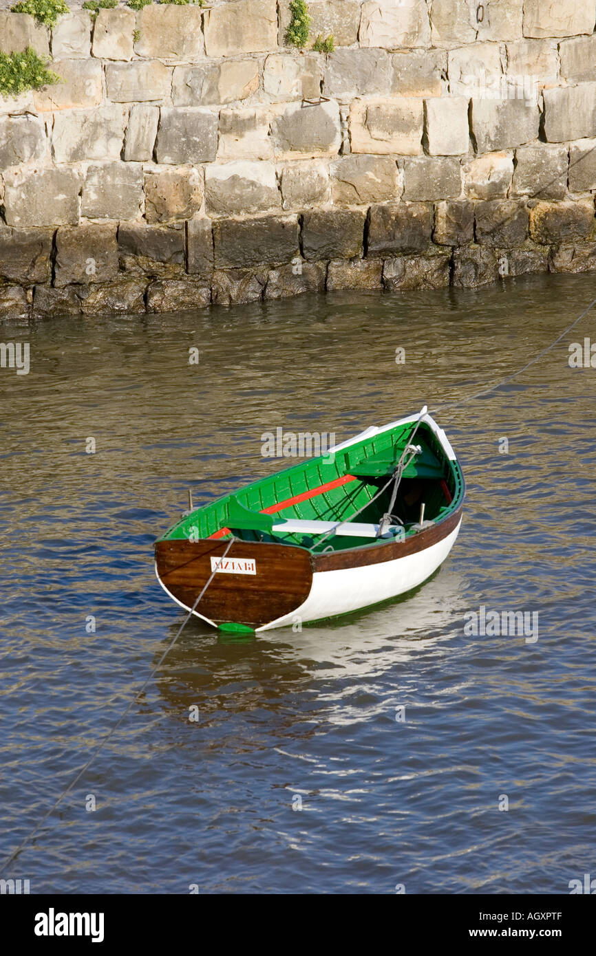 Green and white rowing boat at mooring in harbour Puerto Viejo de ...