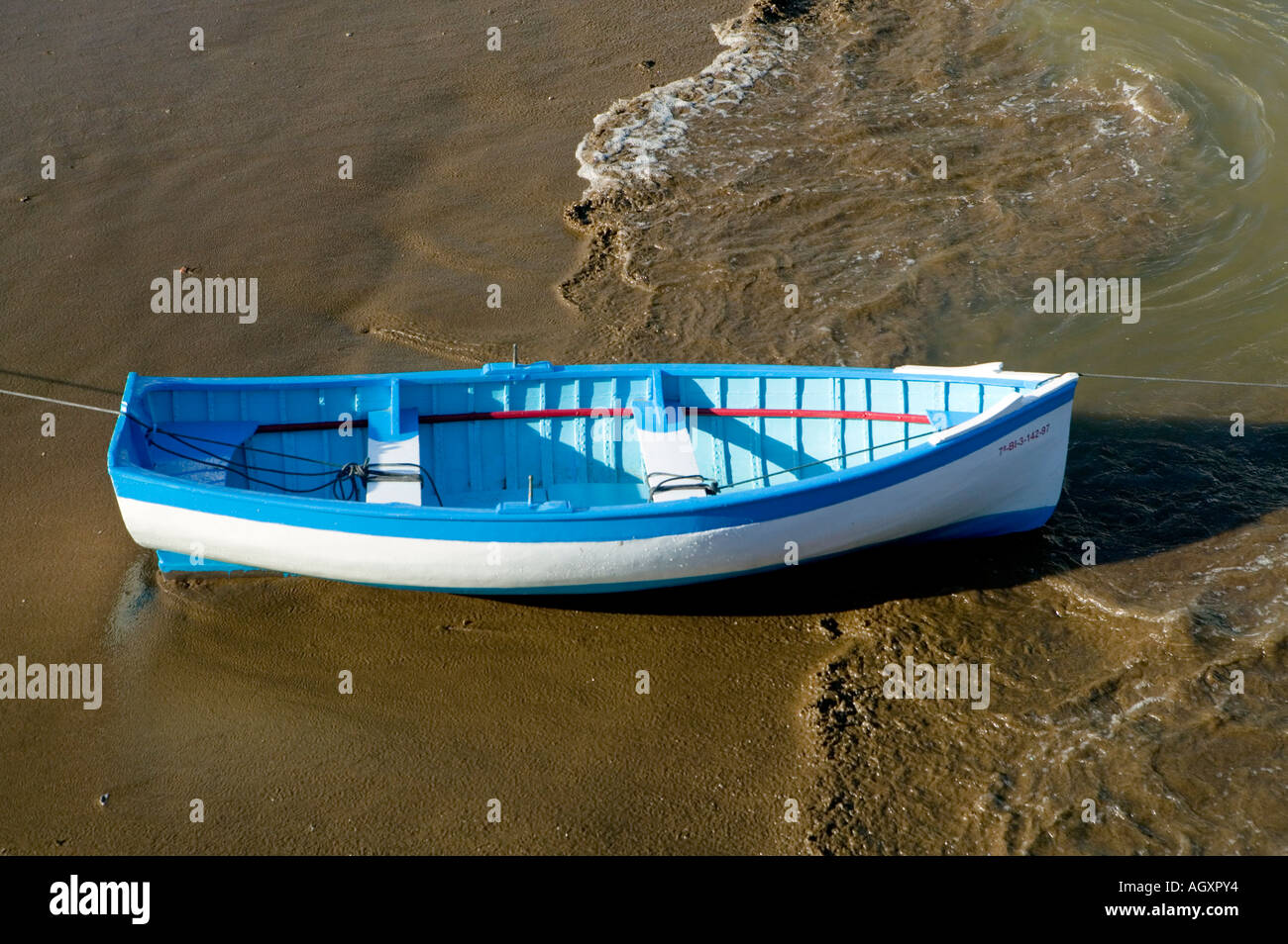 Blue and white rowing boat at mooring in harbour Puerto Viejo de ...