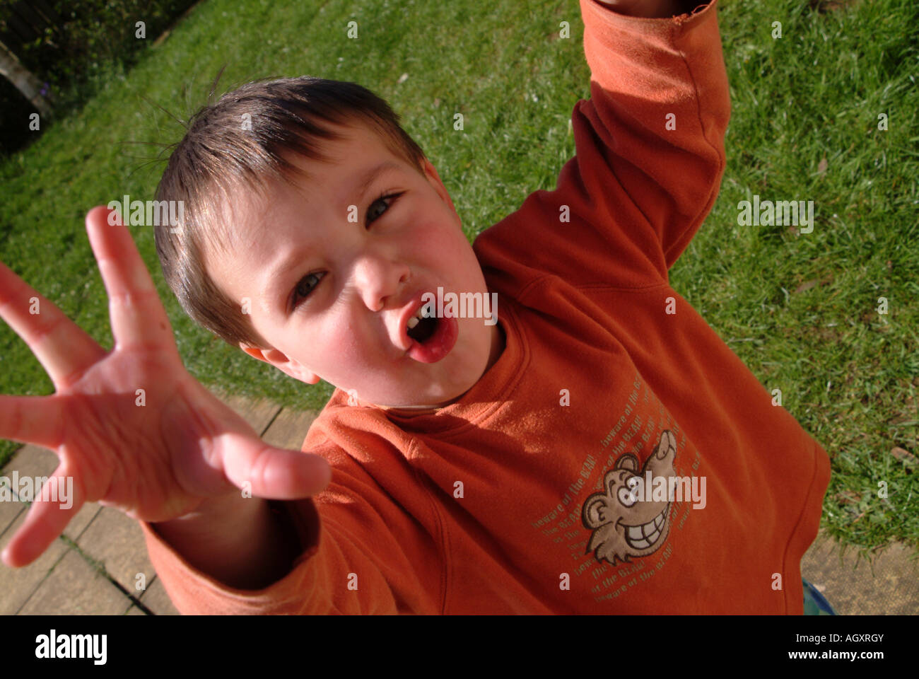 Little boy pulling a scary face Stock Photo - Alamy