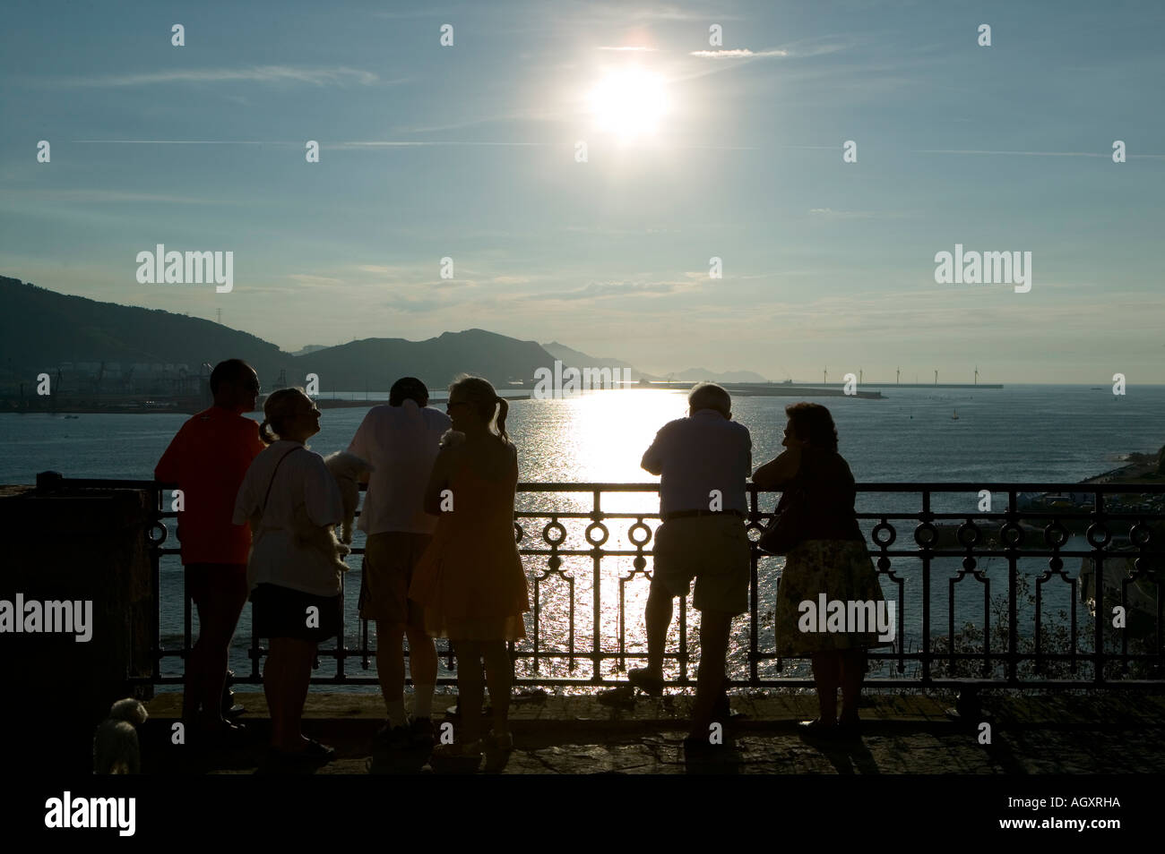 Group of Spanish people silhouetted by setting sun Puerto Viejo de ...
