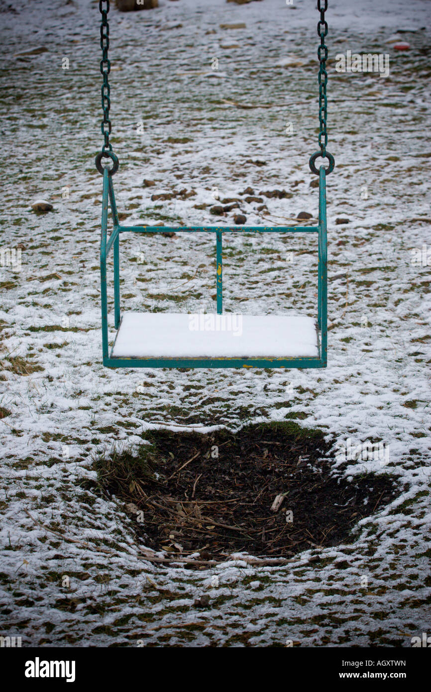 Hammock covered with snow in an isolated park during winter Stock Photo ...