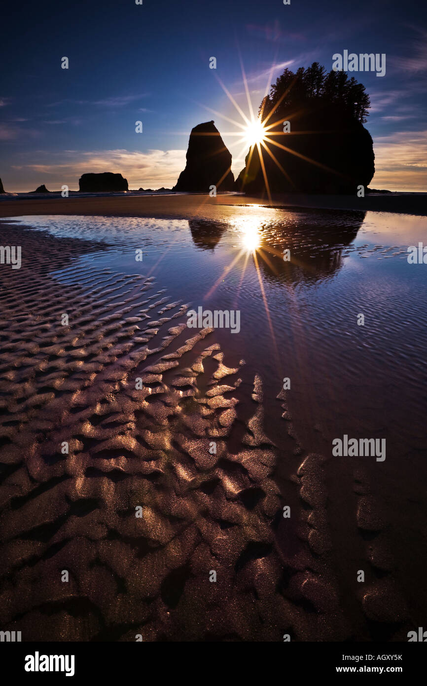 This is a shot of the setting sun and sea stacks at Second Beach in the ...