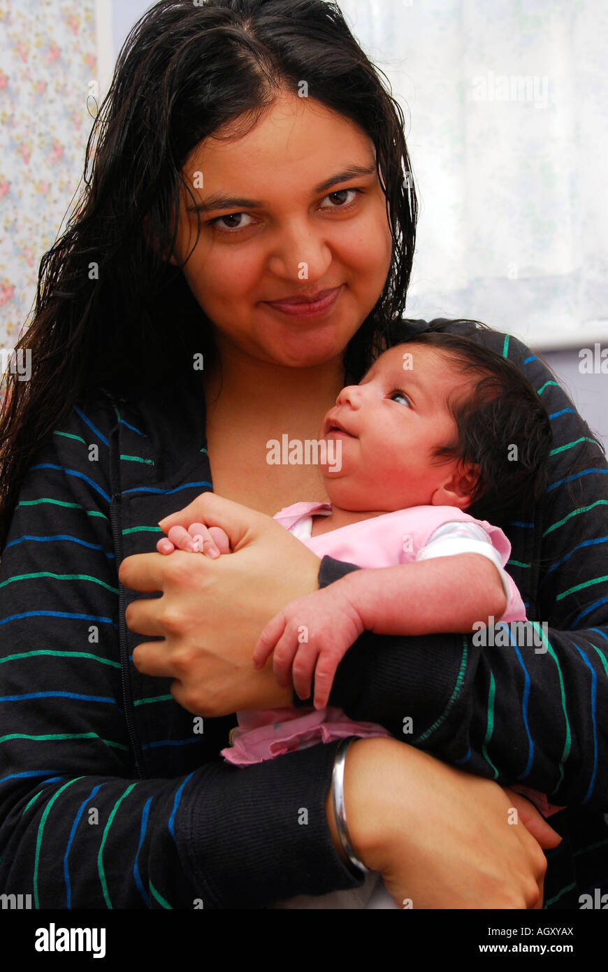 23 year old mother with her 19 day old baby boy, Southall, Middlesex ...