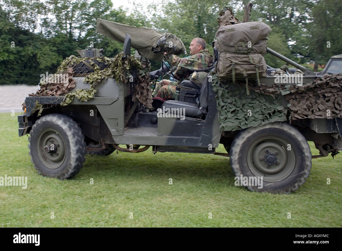 British soldier driving camouflaged combat Landrover Stock Photo - Alamy
