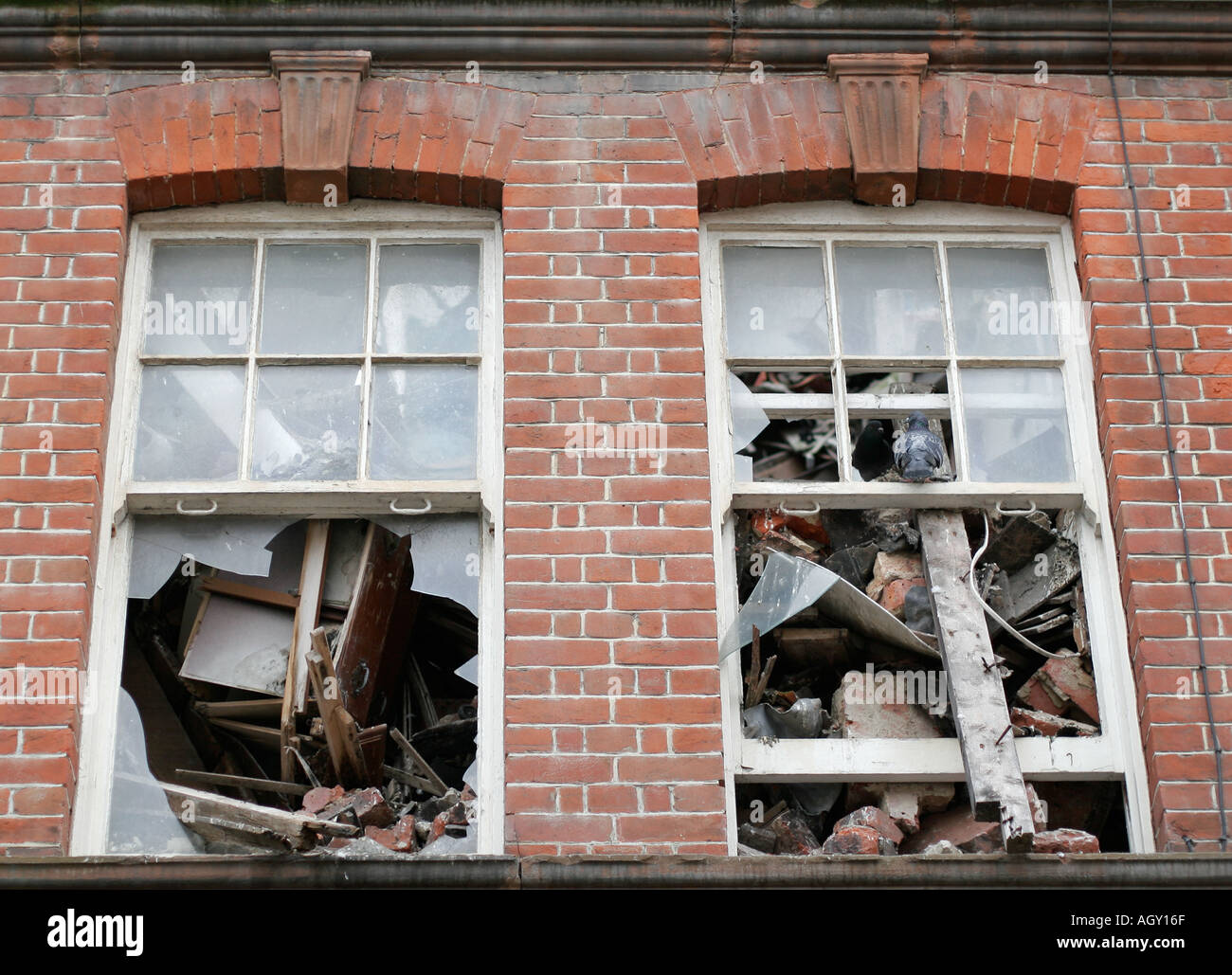 Broken windows of partly demolished apartment building Stock Photo - Alamy
