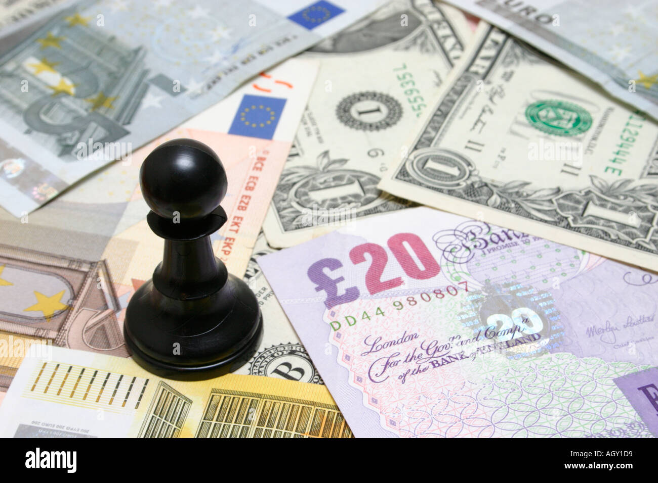 pawn sitting on cash ambitious pawn Stock Photo - Alamy