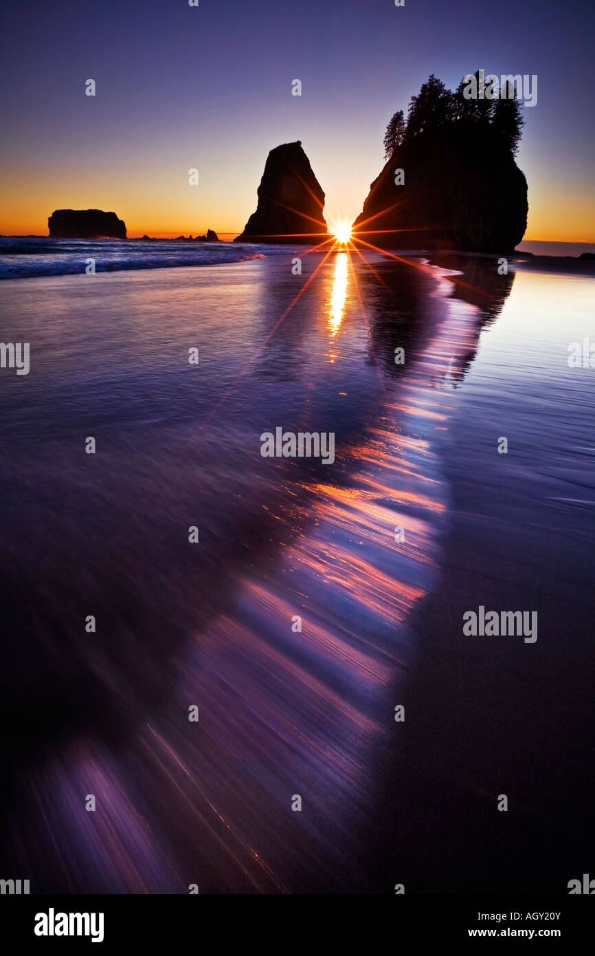 This is a shot of the setting sun and sea stacks at Second Beach in the ...