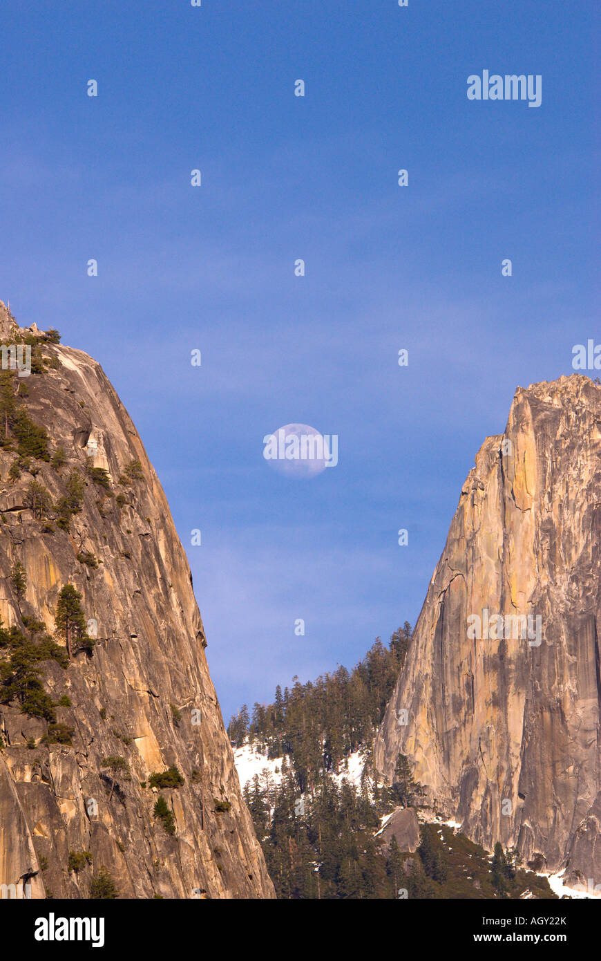 Yosemite National park full moon rising between two granite rocks, half ...