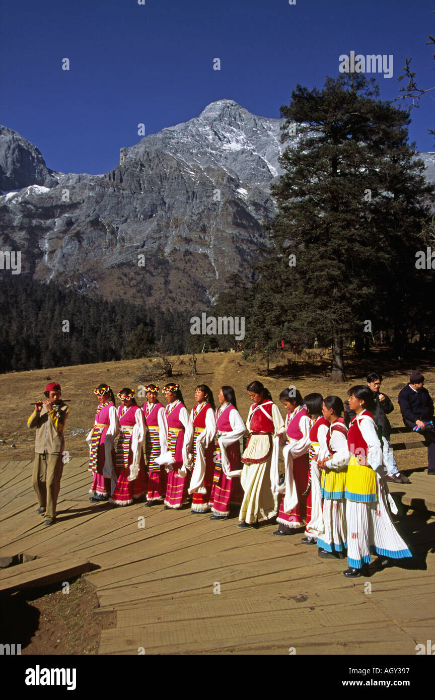 China Yunnan Lijiang Jade Dragon Snow Mountain Naxi girls dancing Stock ...