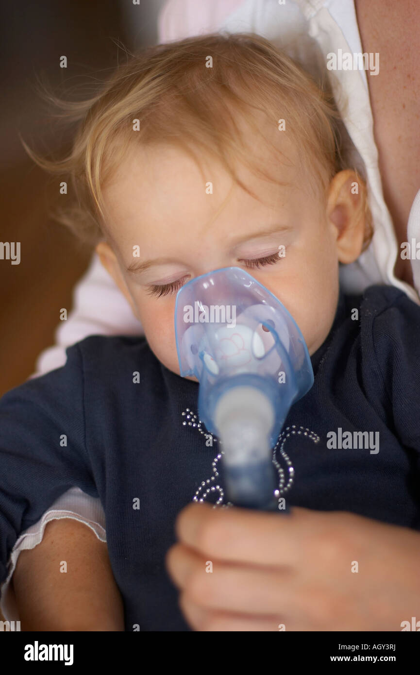 sick child inhaling Stock Photo - Alamy
