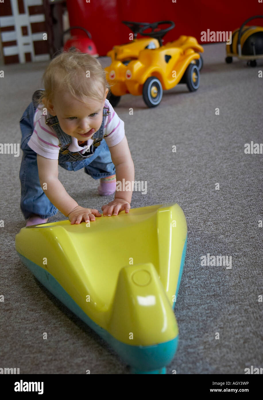 Female child girl playing push hi-res stock photography and images - Alamy