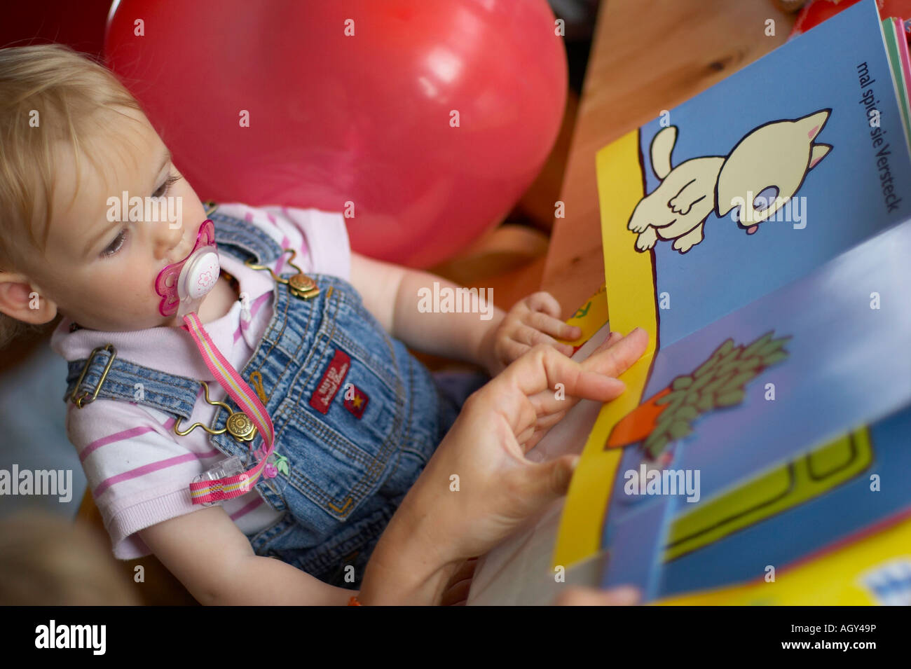 baby reading book Stock Photo - Alamy