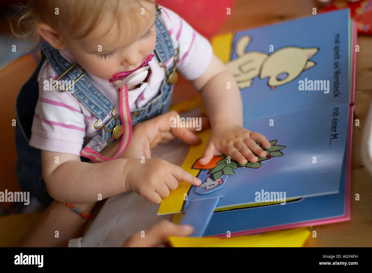 baby reading book Stock Photo - Alamy