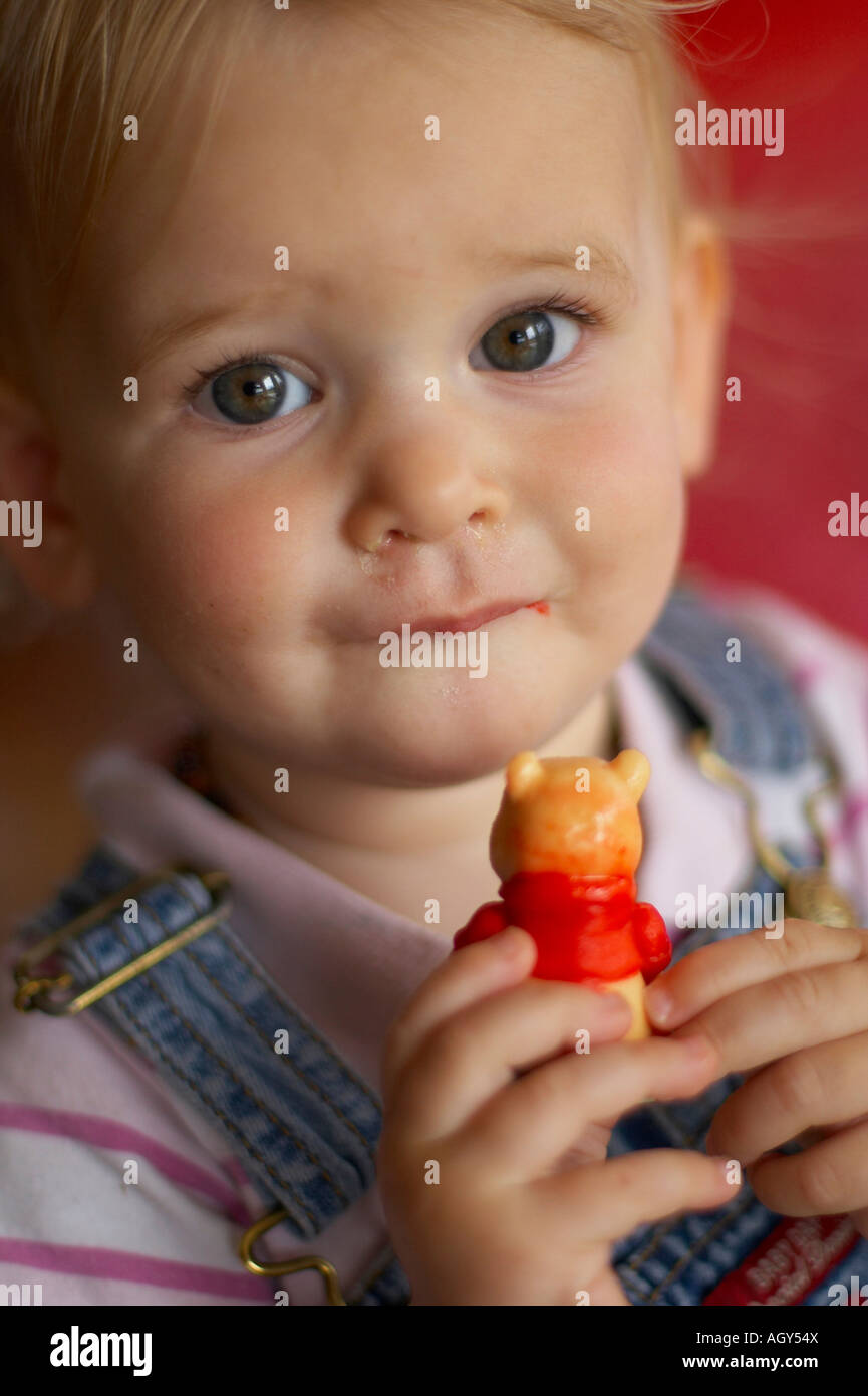baby eating sweet Stock Photo - Alamy