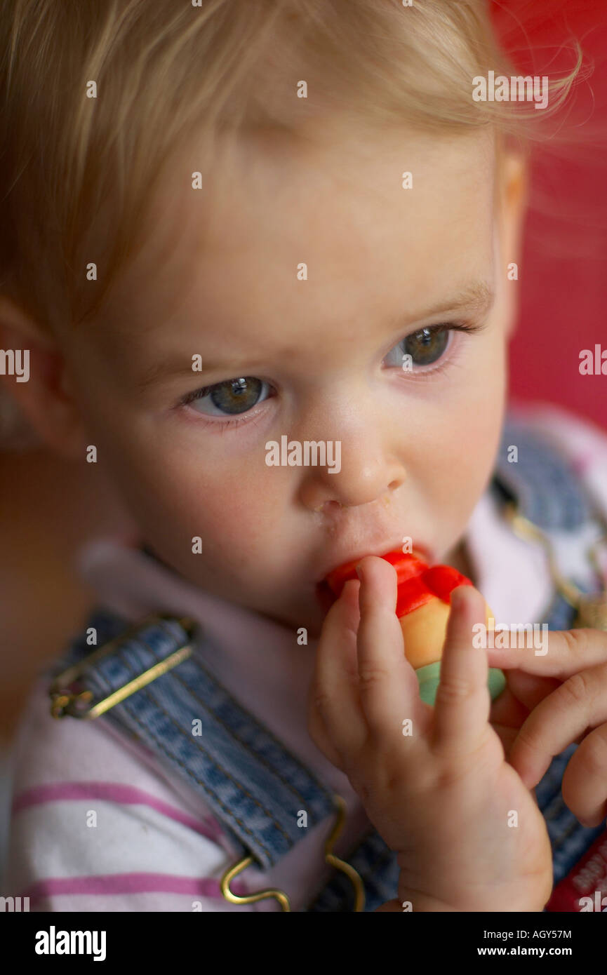 baby eating sweet Stock Photo - Alamy
