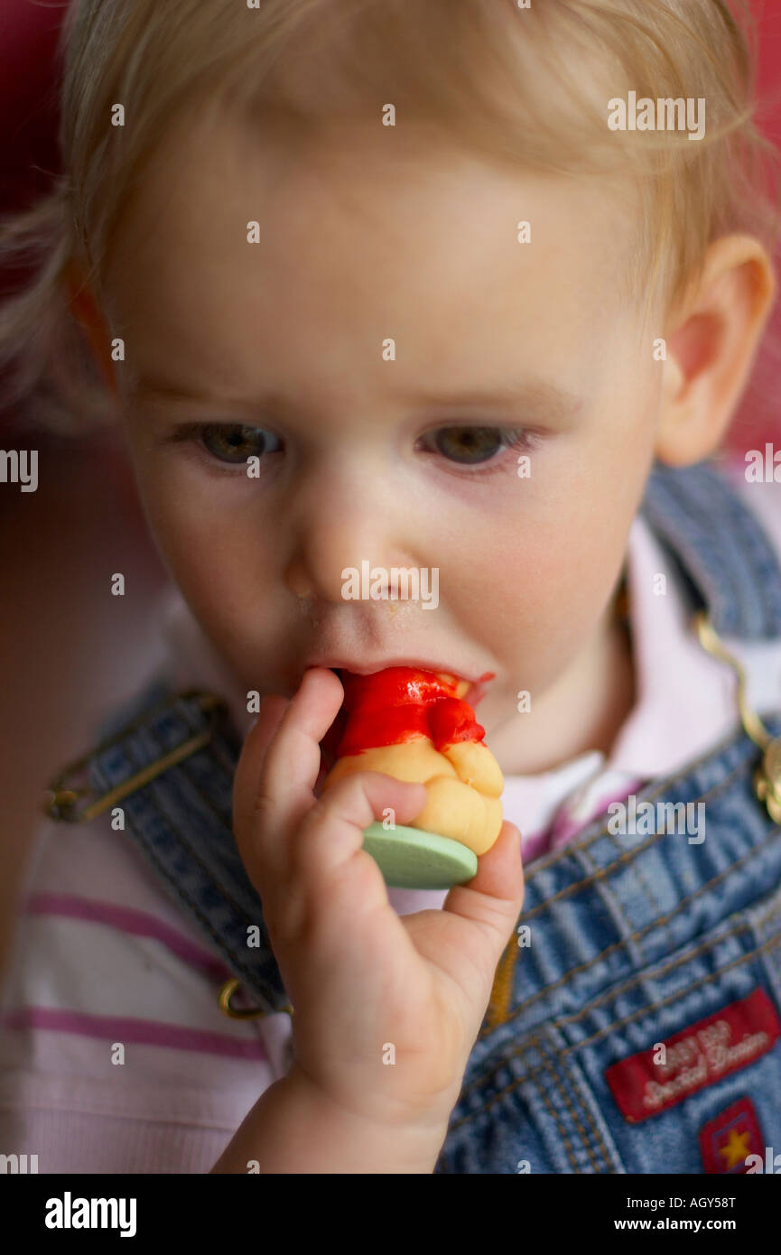 baby eating sweet Stock Photo - Alamy