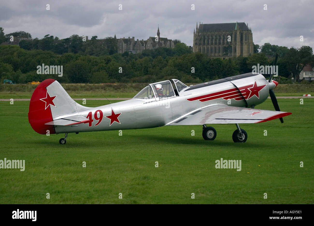Russian Yakovlev Yak-52 Trainer plane taxiing down the grass runway at ...