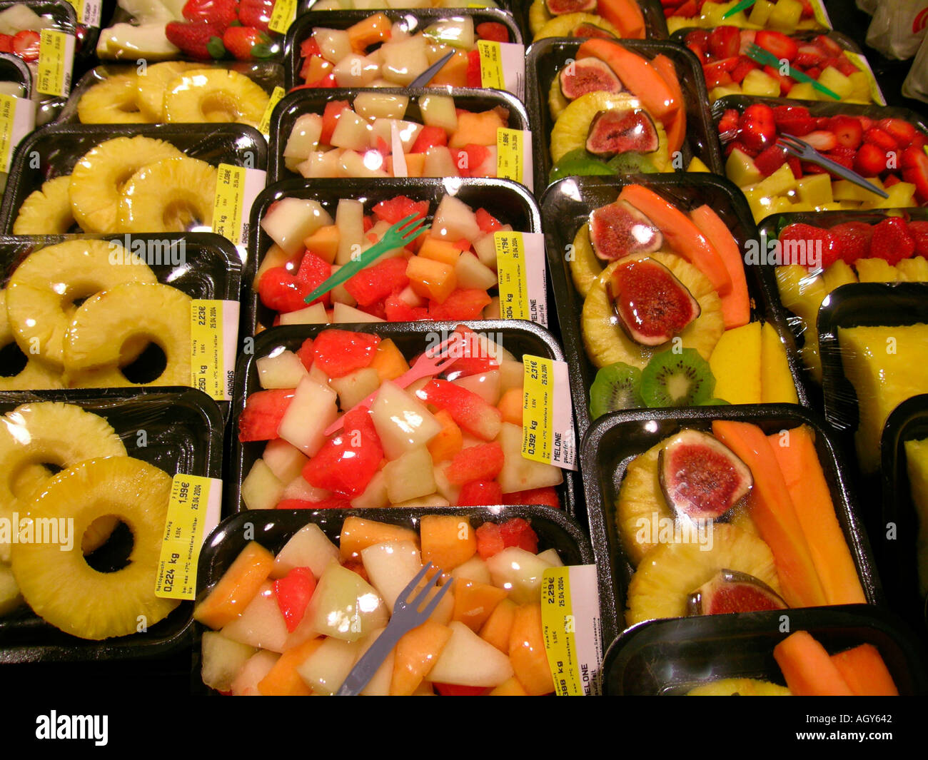 colourful fruits ready to eat for sale arranged on plates Stock Photo ...