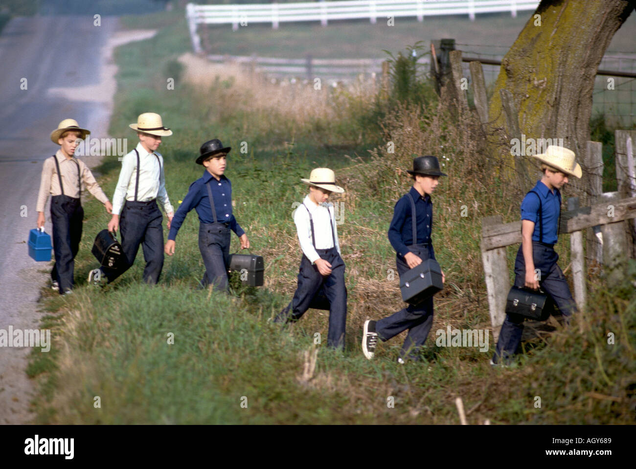 6 boys form a line as they walk to school Stock Photo - Alamy