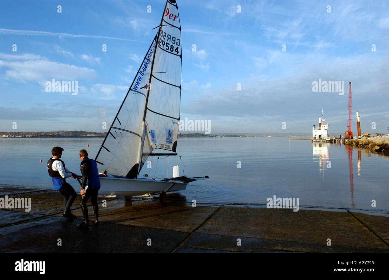 A small racing yacht is pulled from the water at Weymouth and Portland ...