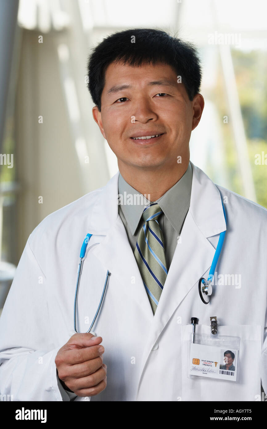 Middle aged male Asian doctor Stock Photo - Alamy