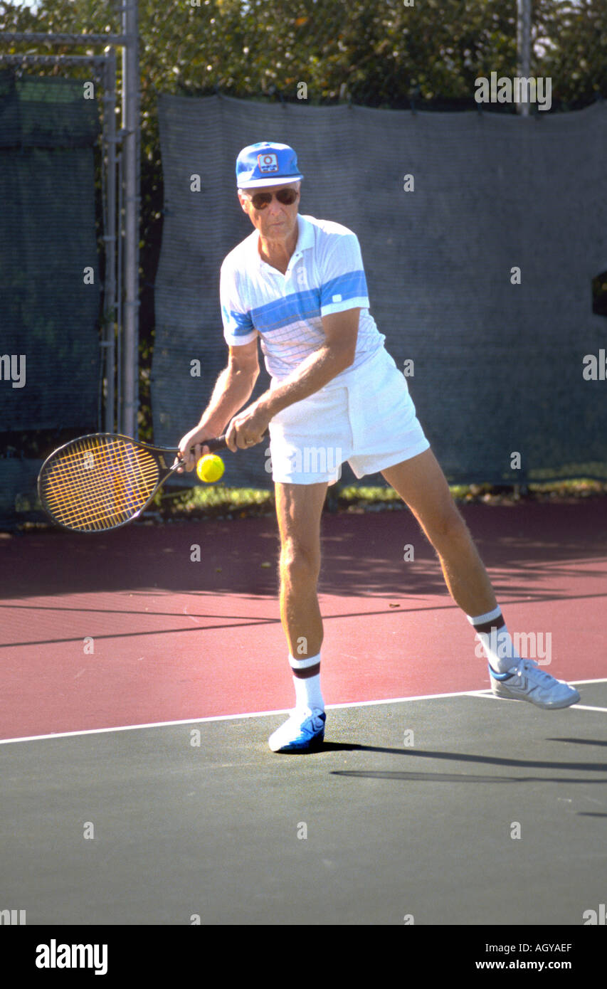 Senior males play game tennis for recreation in retirement Stock Photo ...