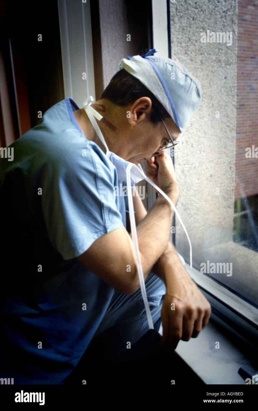 Exhausted doctor after performing an operation Stock Photo - Alamy