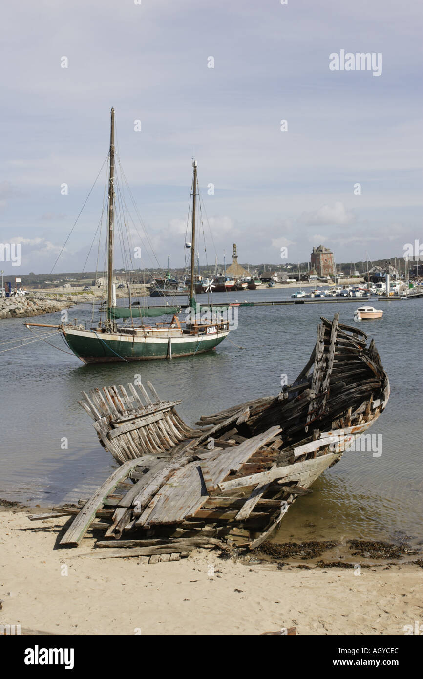 Abandoned fishing boats lying derelict in harbour Caramet Sur Mer SW ...