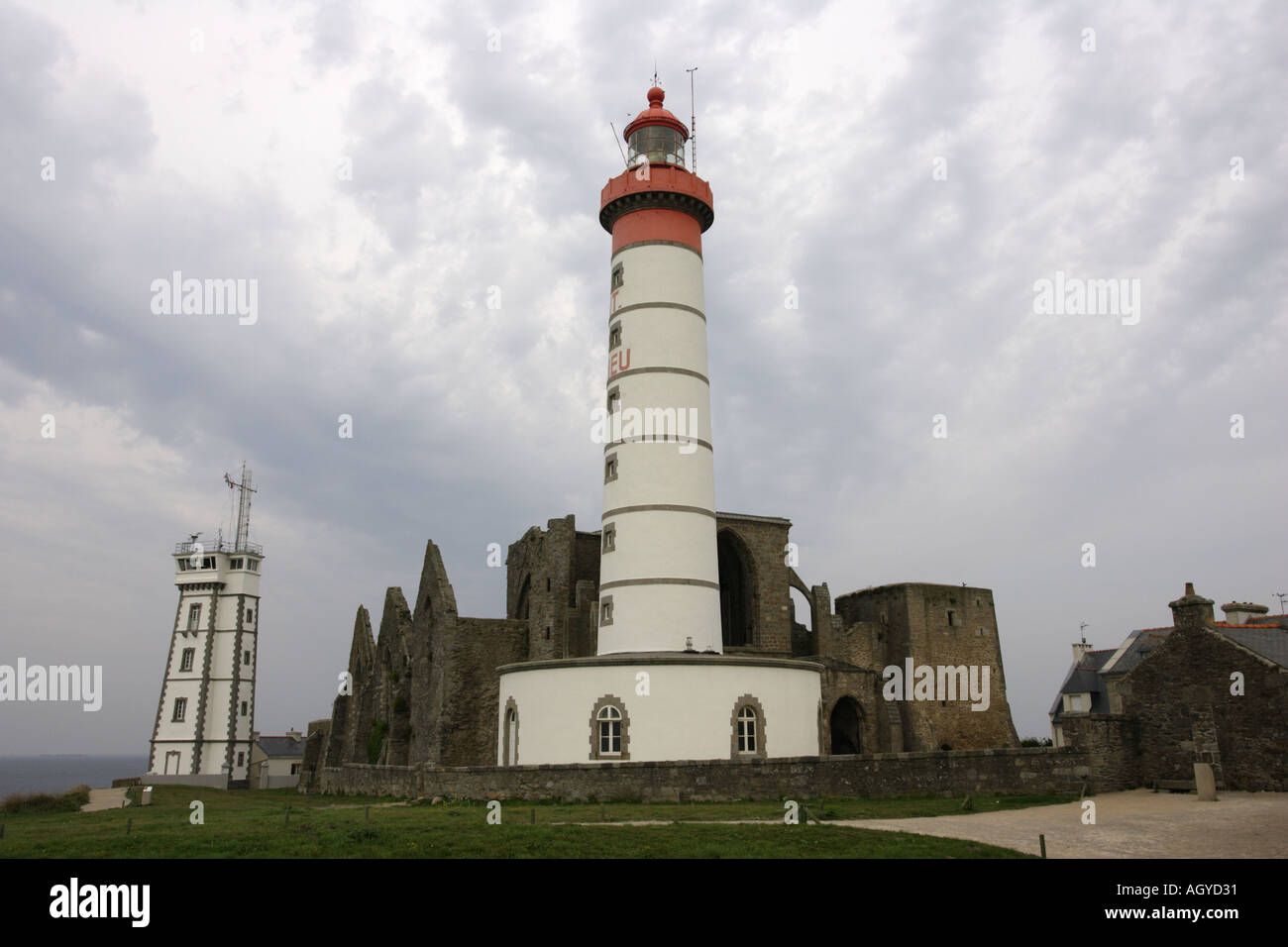 Phare St Mathieu and ruins 16 cent abbey Pointe de St Mathieu Brittany ...