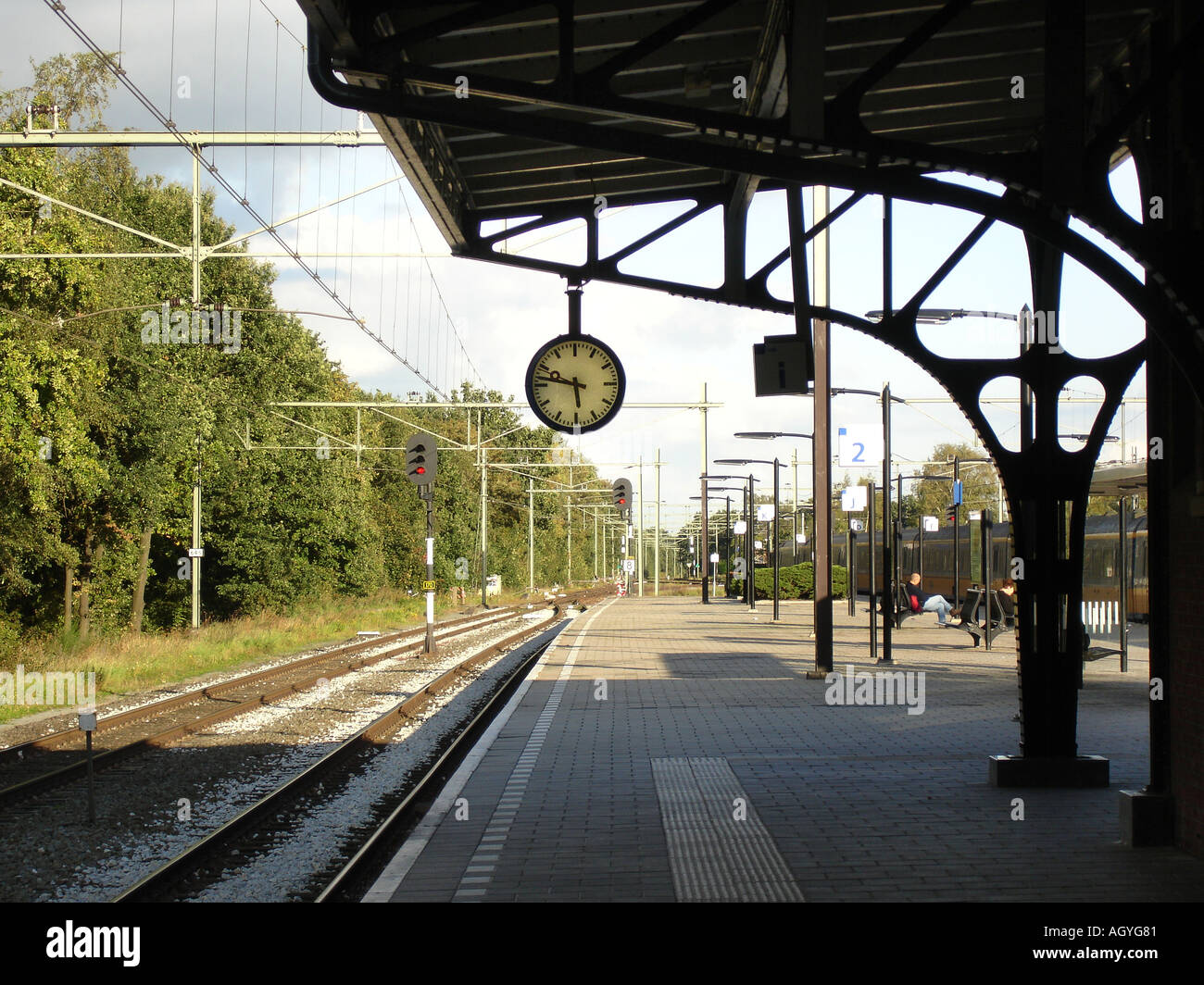 Train awaiting departure on platform at railway station hi-res stock ...