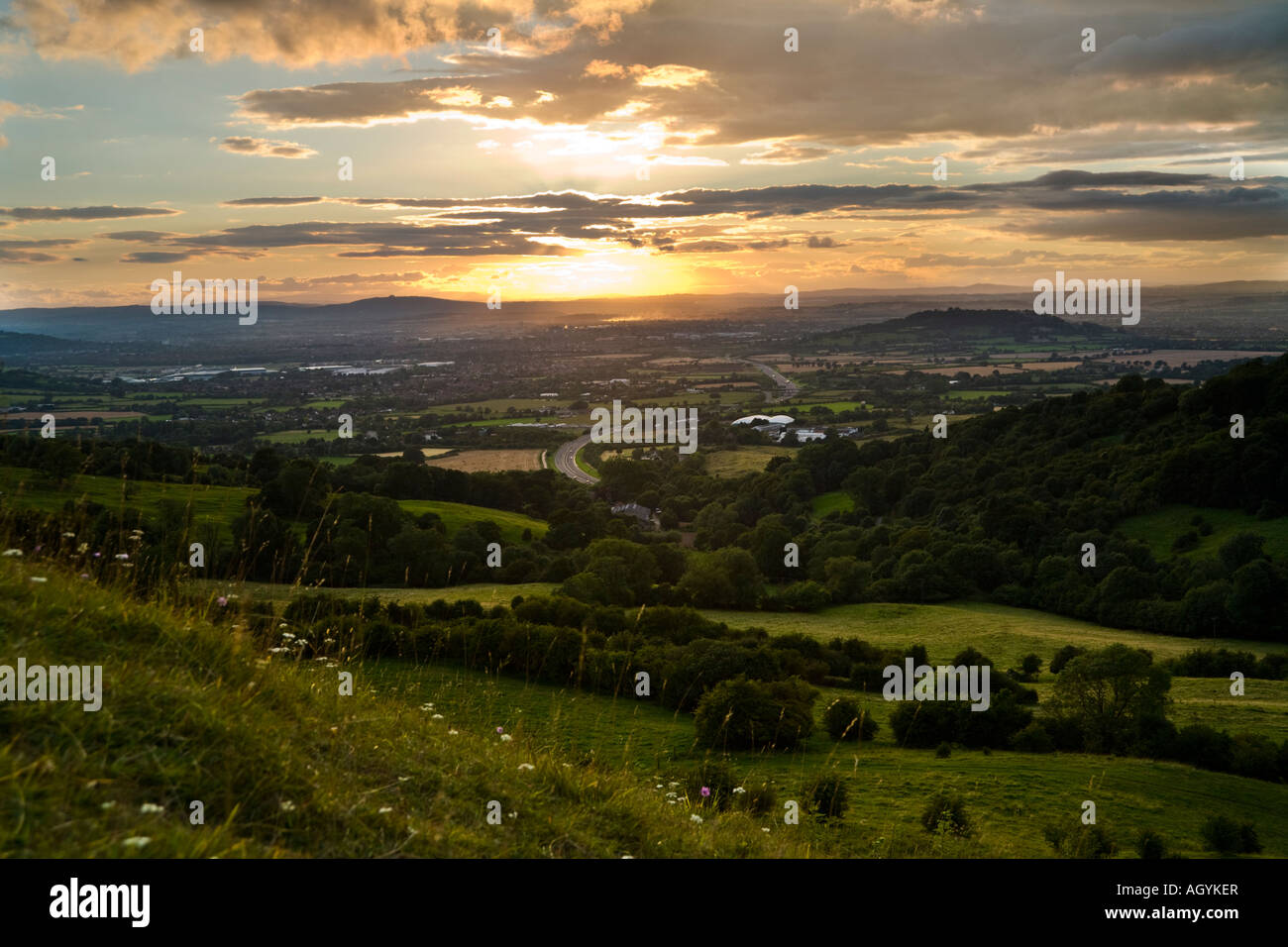 A sunset looking towards Gloucester from the Cotswold scarp at Barrow ...