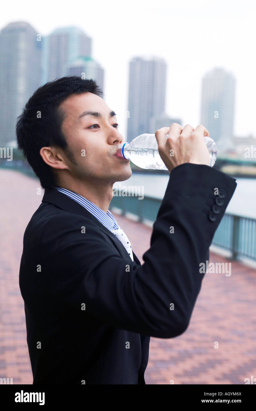 Business man drinking water Stock Photo - Alamy