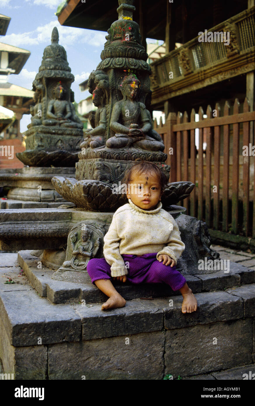 Nepal child amongst the shrines Pataan 1 Stock Photo - Alamy