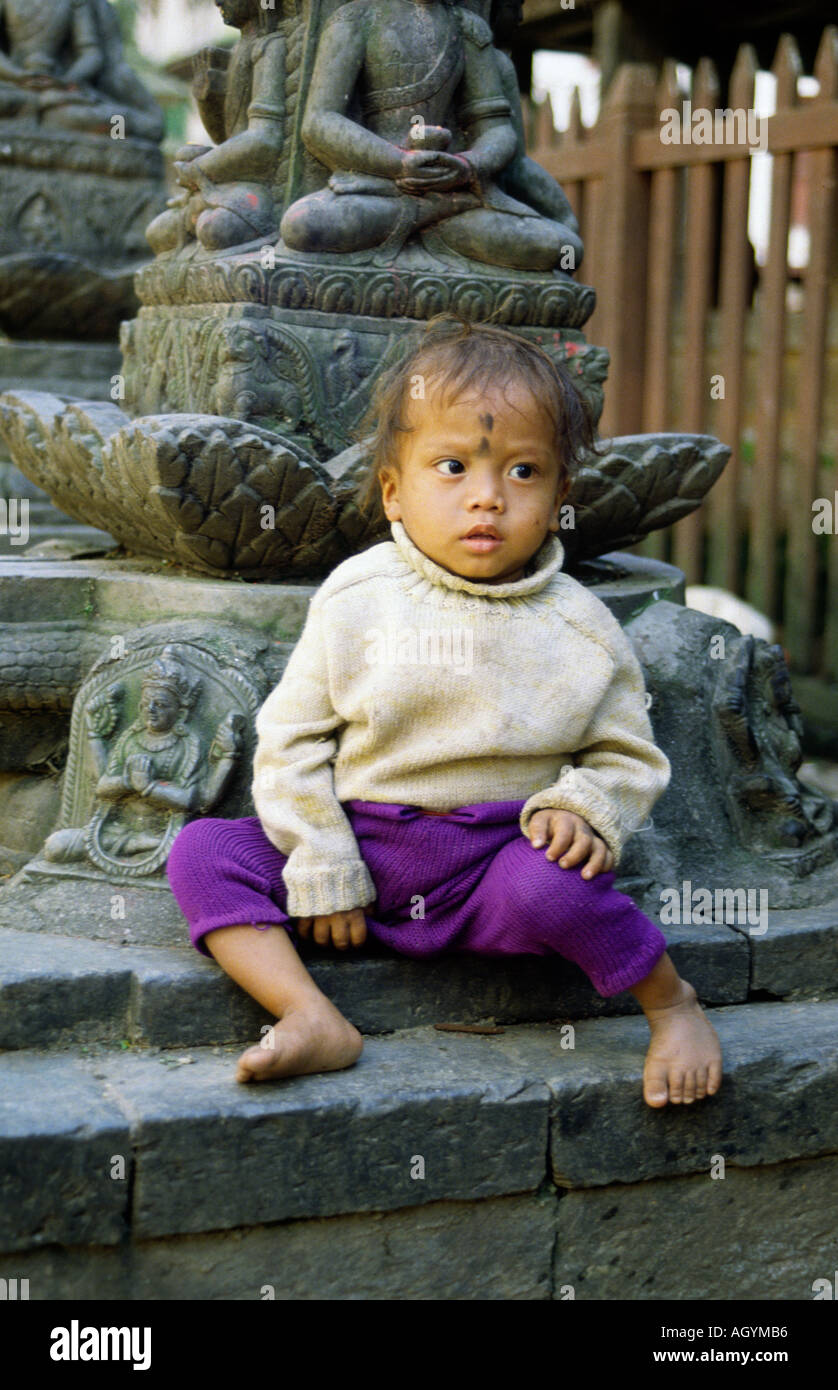 Nepal child amongst the shrines Pataan 2 Stock Photo - Alamy
