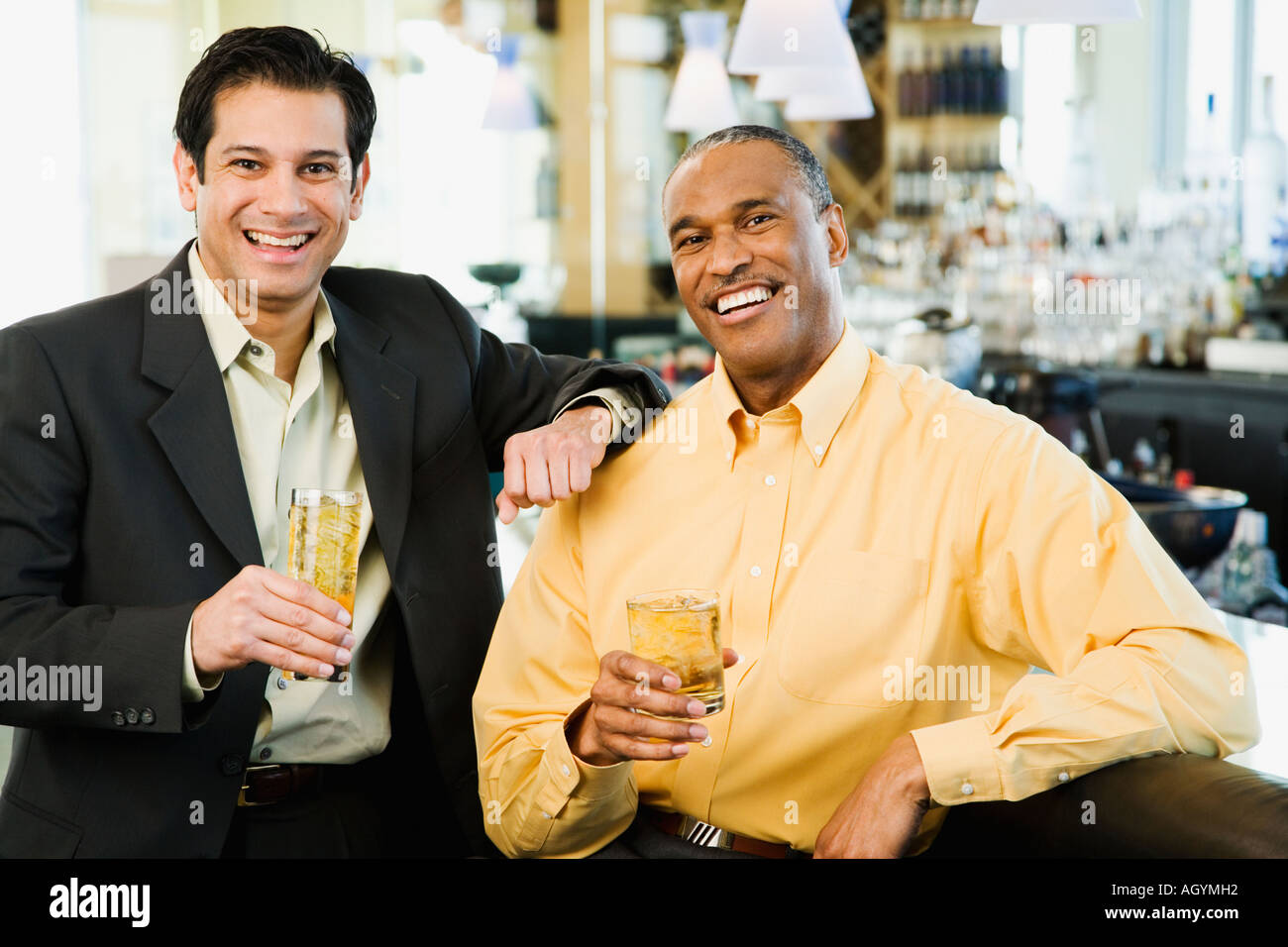 Two men with drinks at bar Stock Photo - Alamy