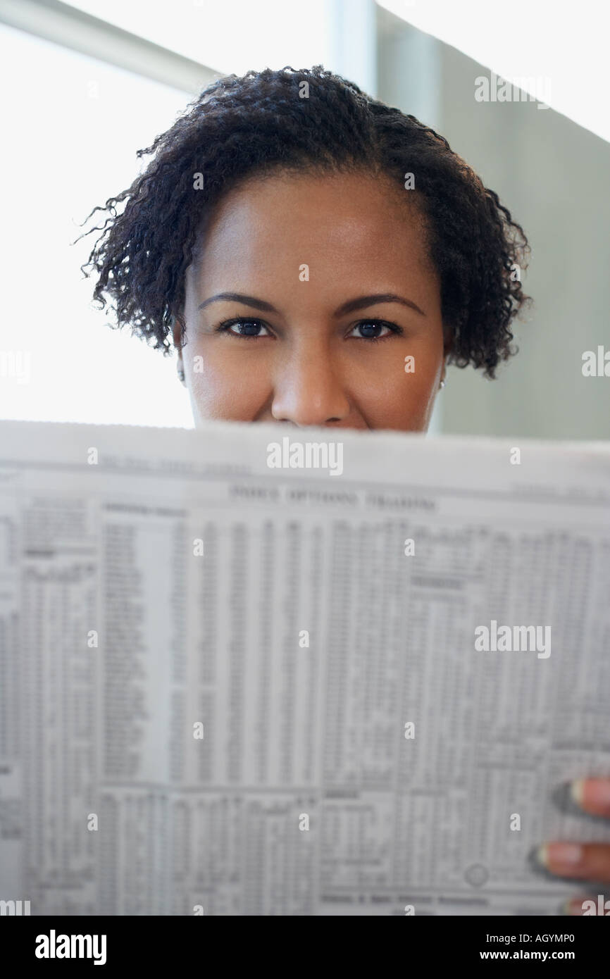 African American woman reading newspaper Stock Photo - Alamy