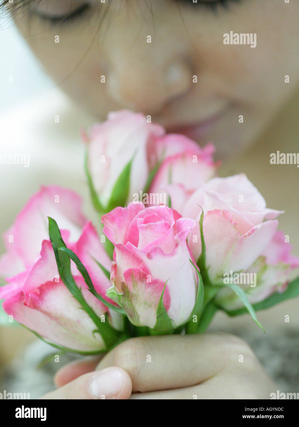 Smelling roses asian hi-res stock photography and images - Alamy