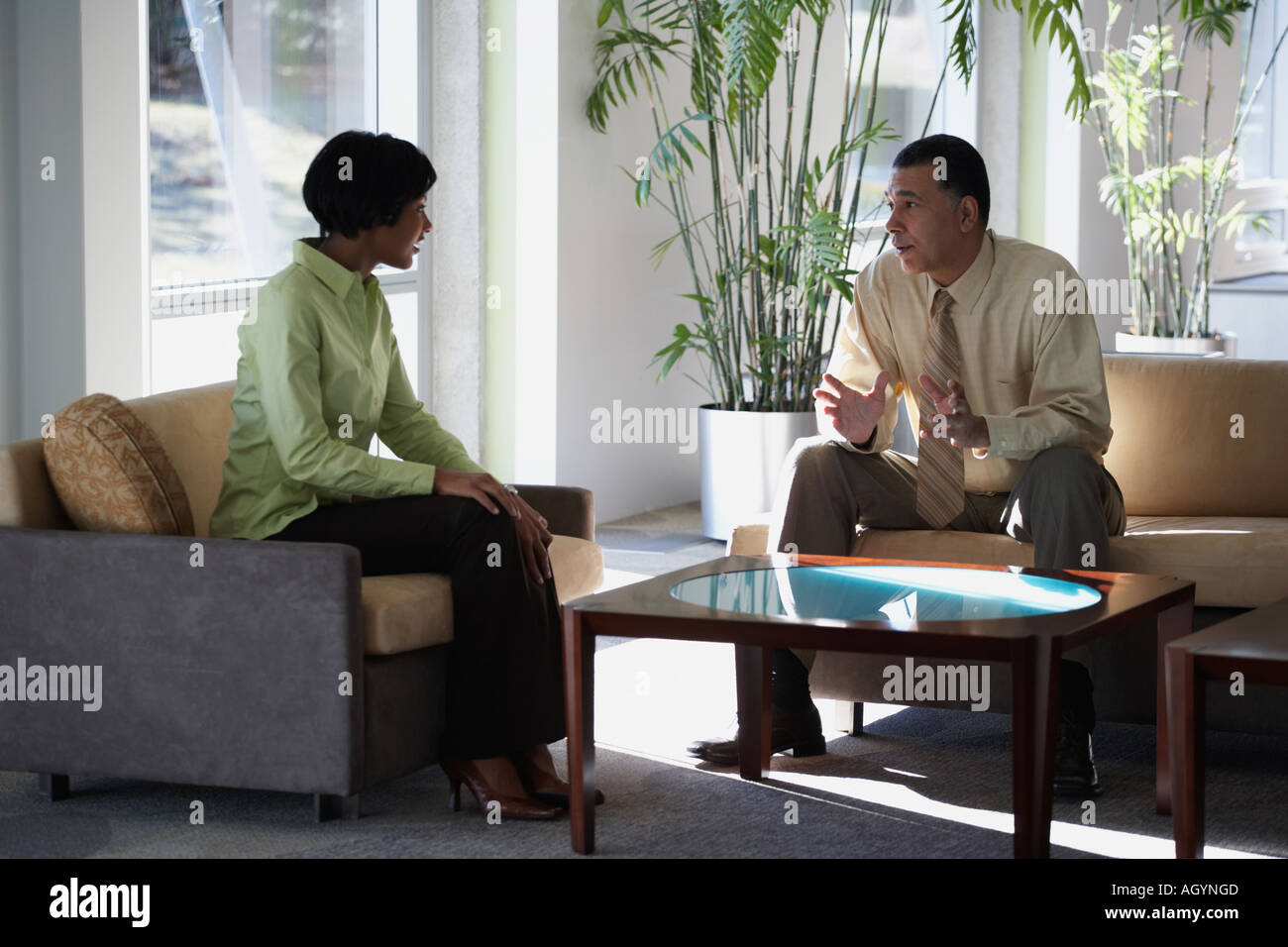 Two businesspeople talking Stock Photo - Alamy Two businesspeople talking Stock Photo - Alamy