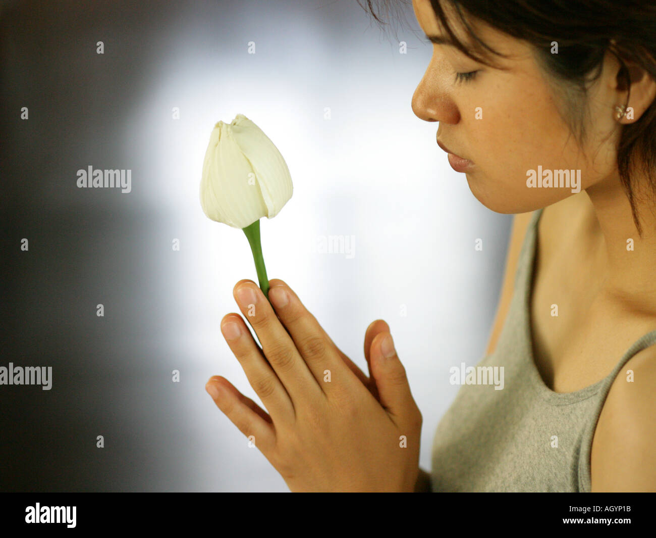 Side profile of a young woman praying Stock Photo - Alamy