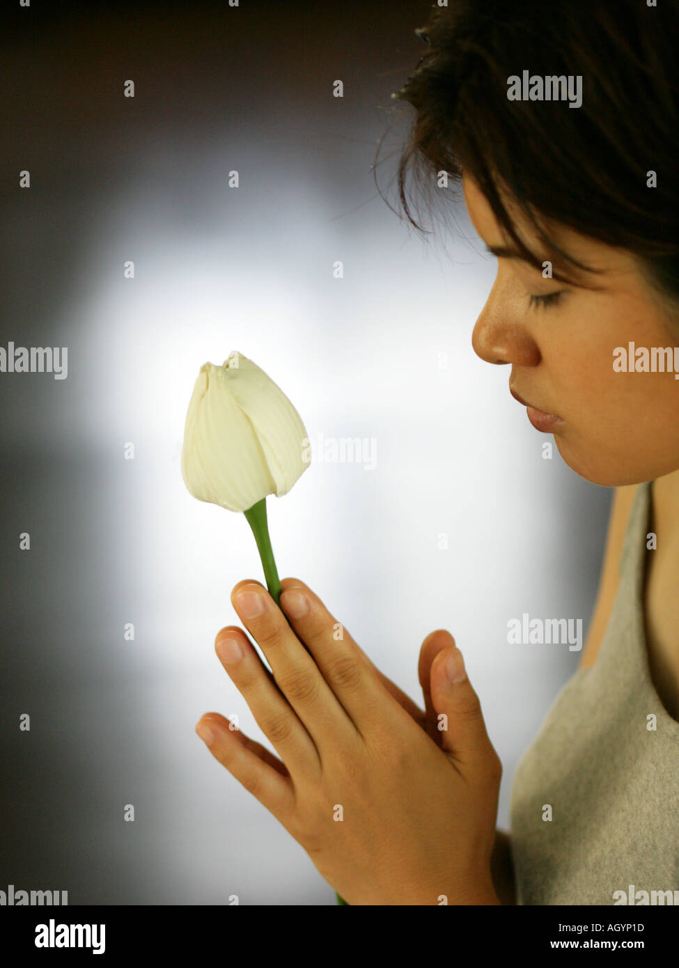 Side profile of a young woman praying Stock Photo - Alamy
