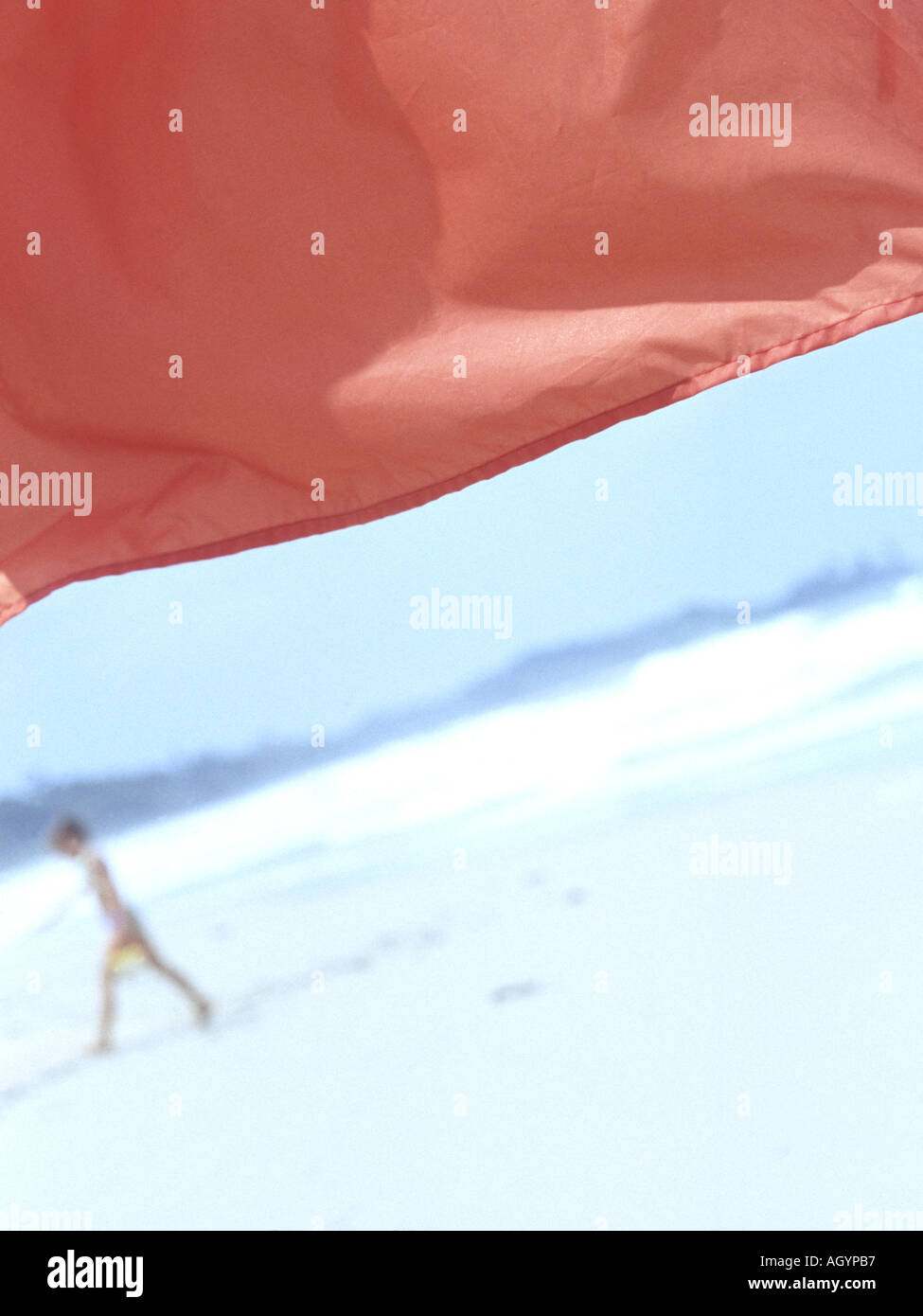Side profile of a person walking on a beach Stock Photo - Alamy
