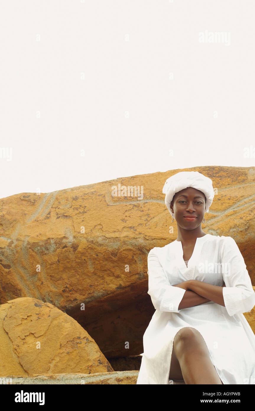 Lady sitting on rocks hi-res stock photography and images - Alamy