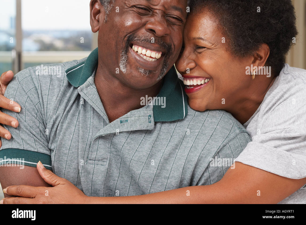 Senior African American couple hugging Stock Photo - Alamy