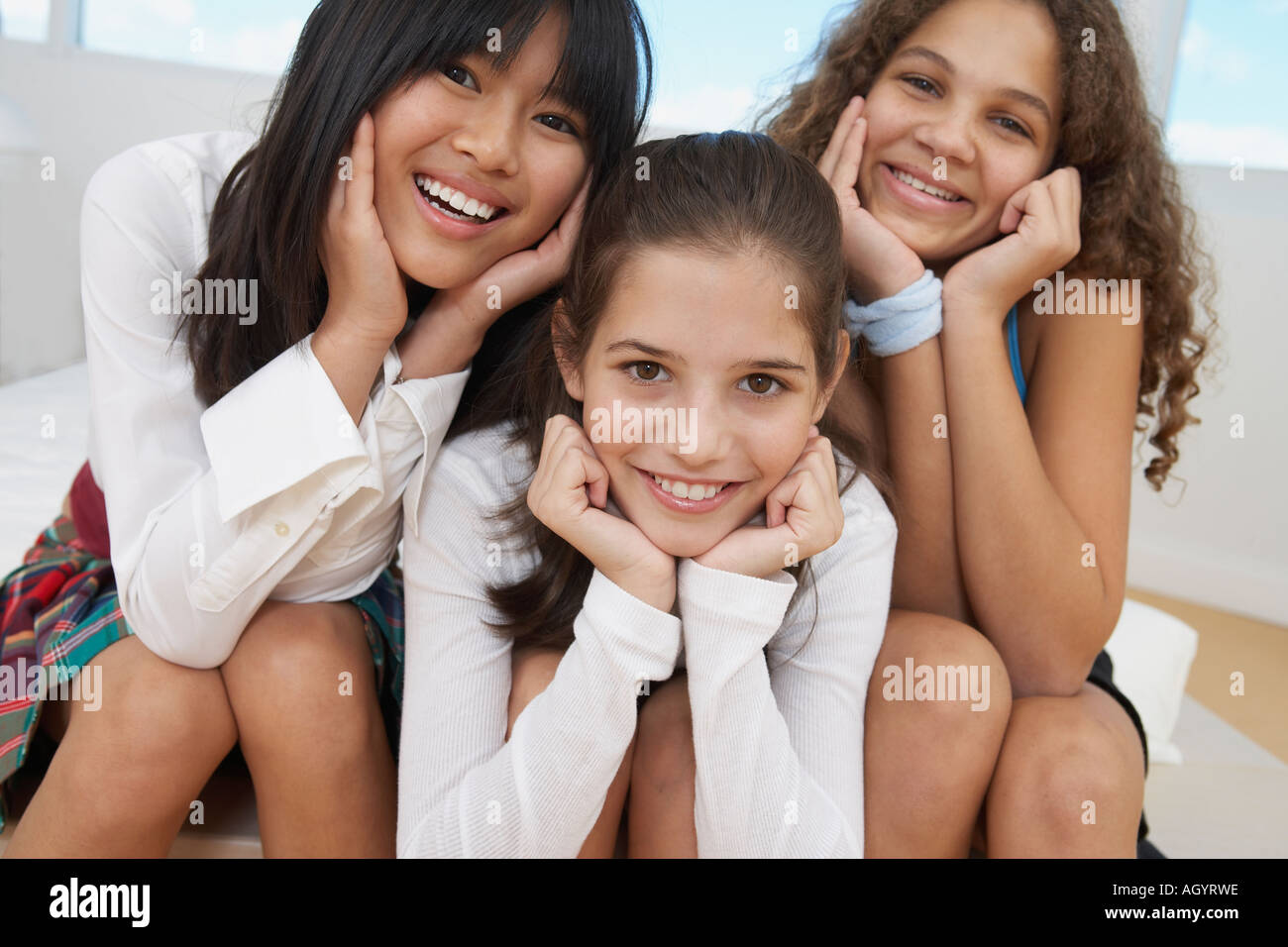 Three teenaged girls smiling Stock Photo - Alamy