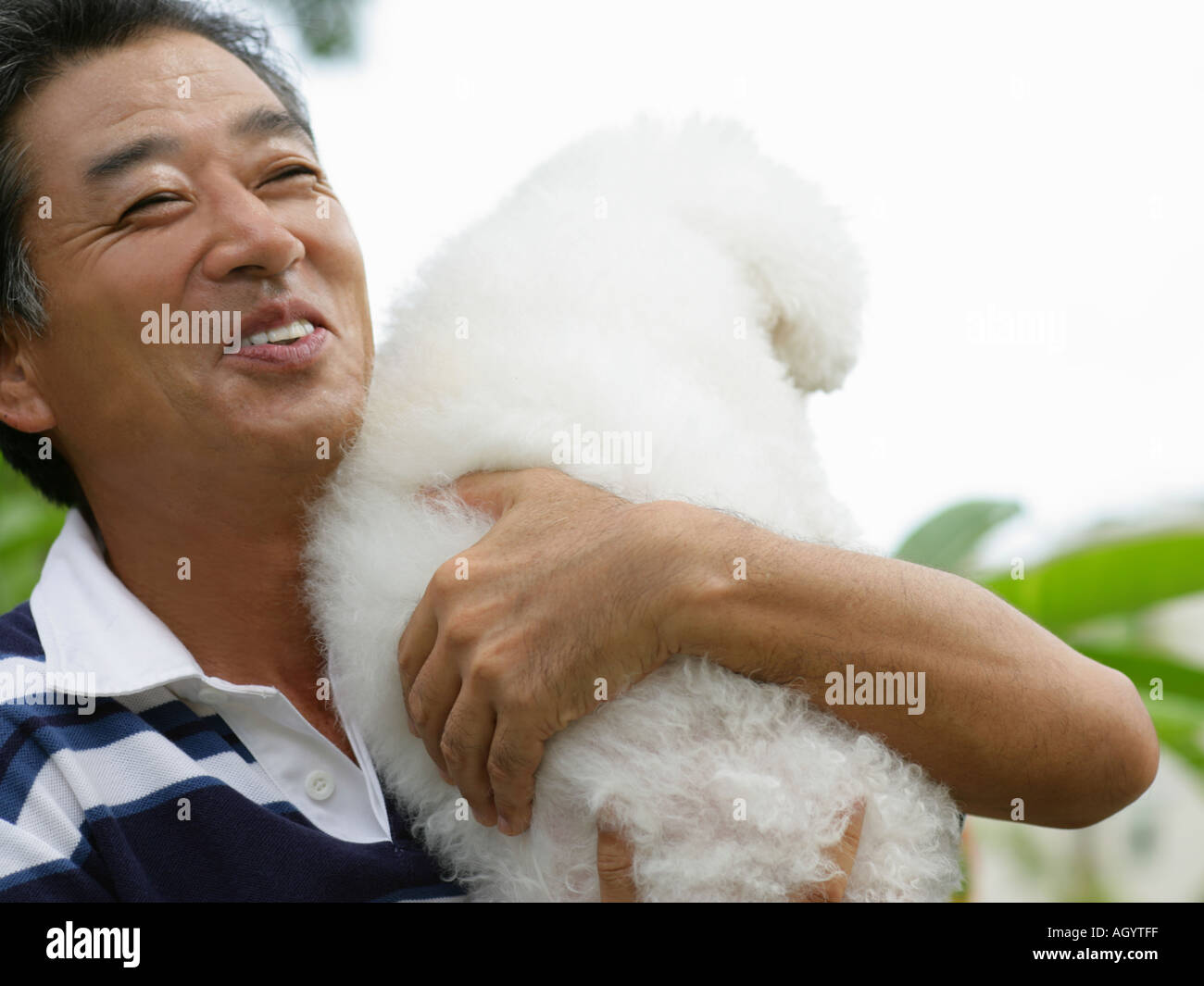Man carrying his dog hi-res stock photography and images - Alamy