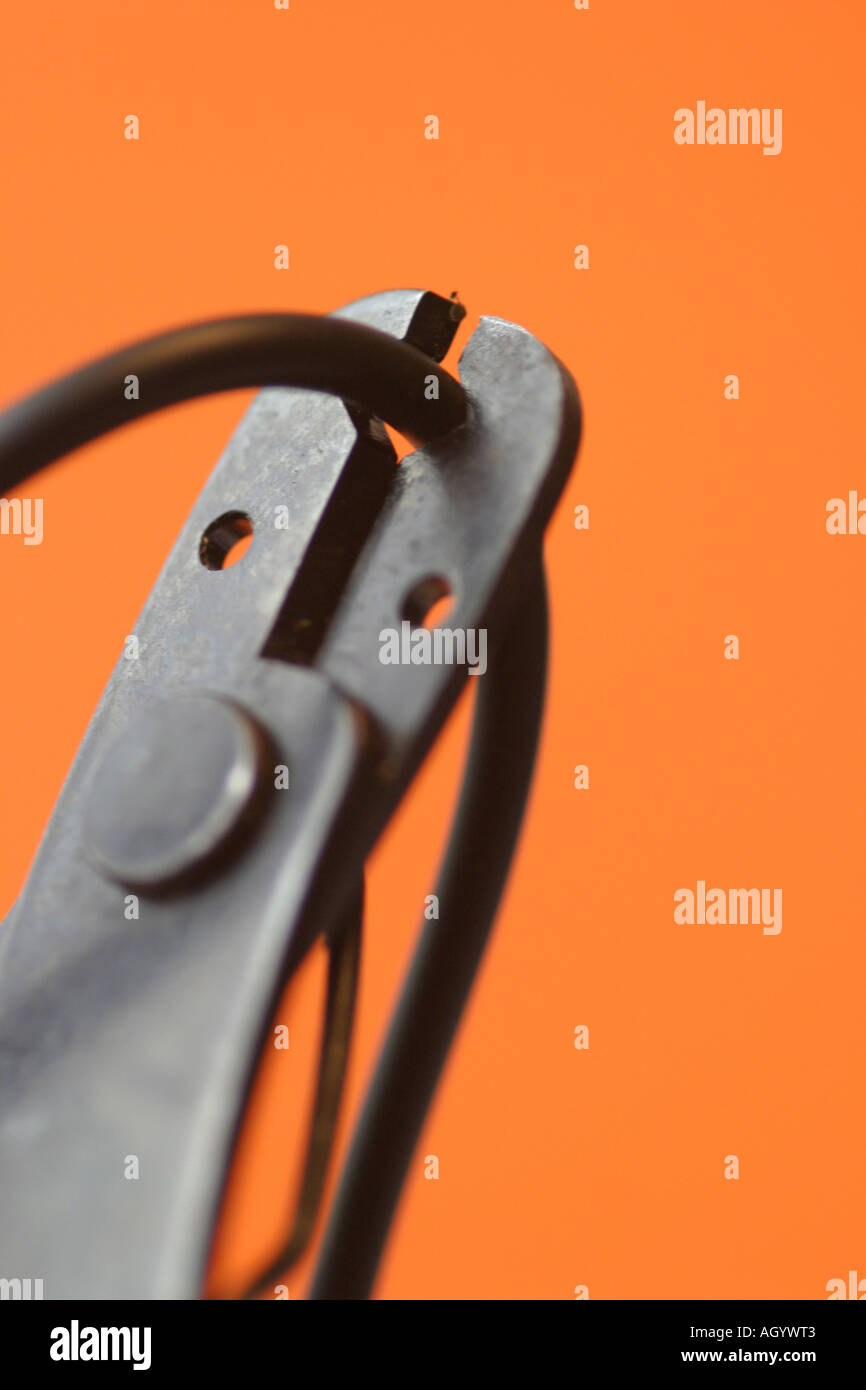 A stock photograph of a wire being cut by wire cutters Stock Photo - Alamy